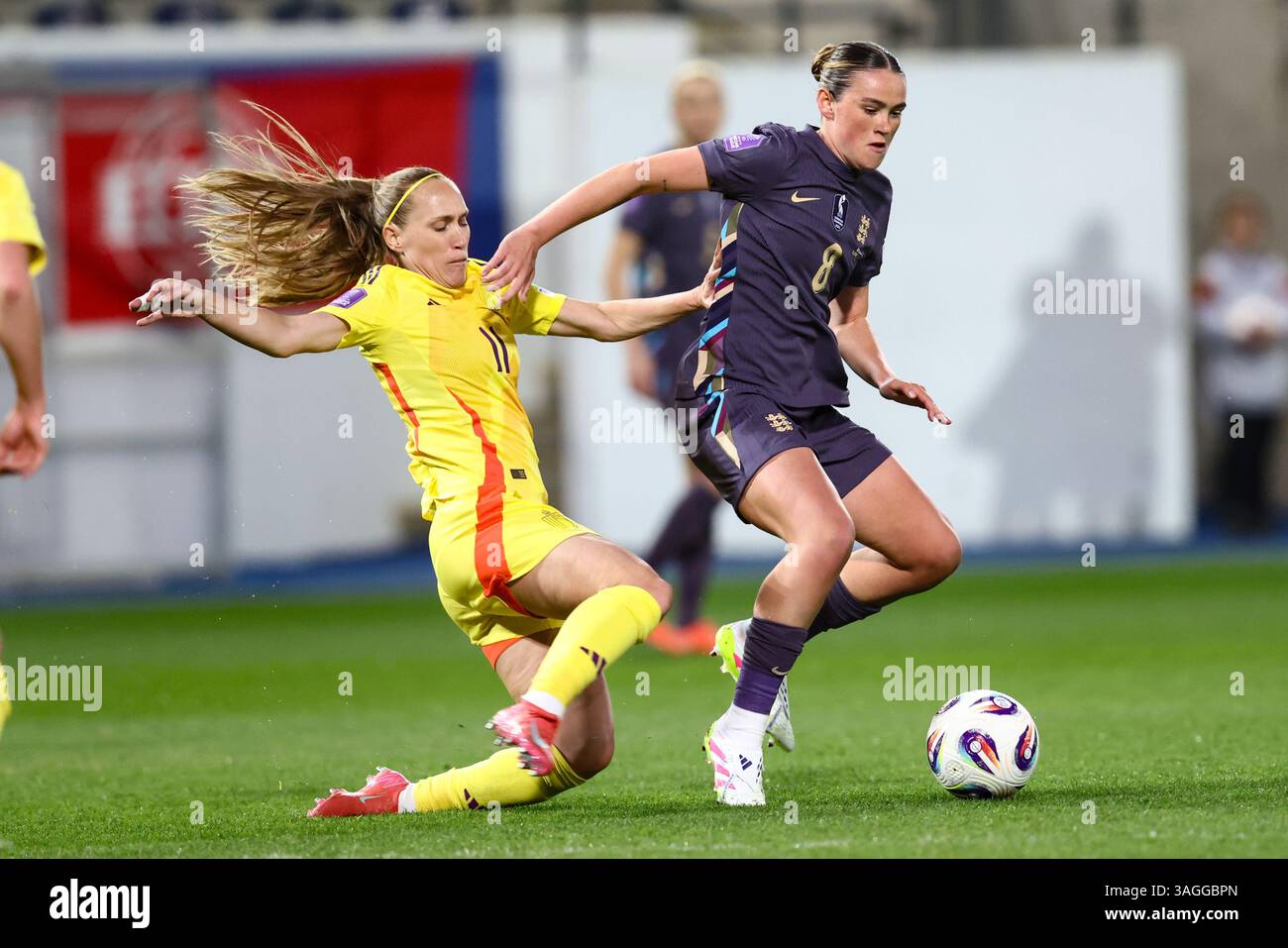 Belgium's Janice Cayman and England's Grace Clinton fight for the ball ...