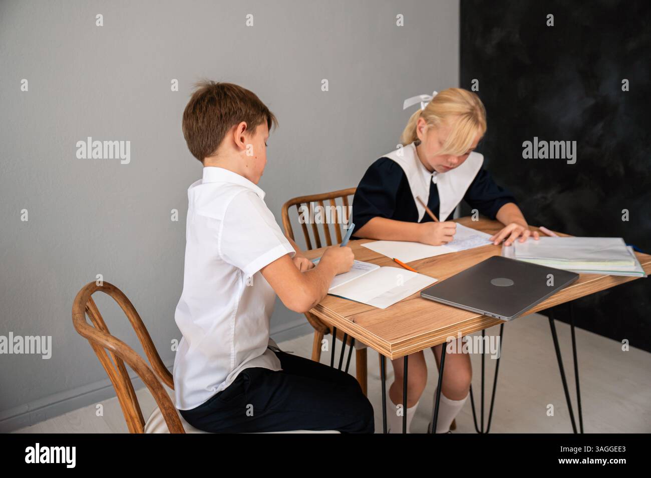 Children School Uniform Classroom Writing Homework Stock Photo - Alamy