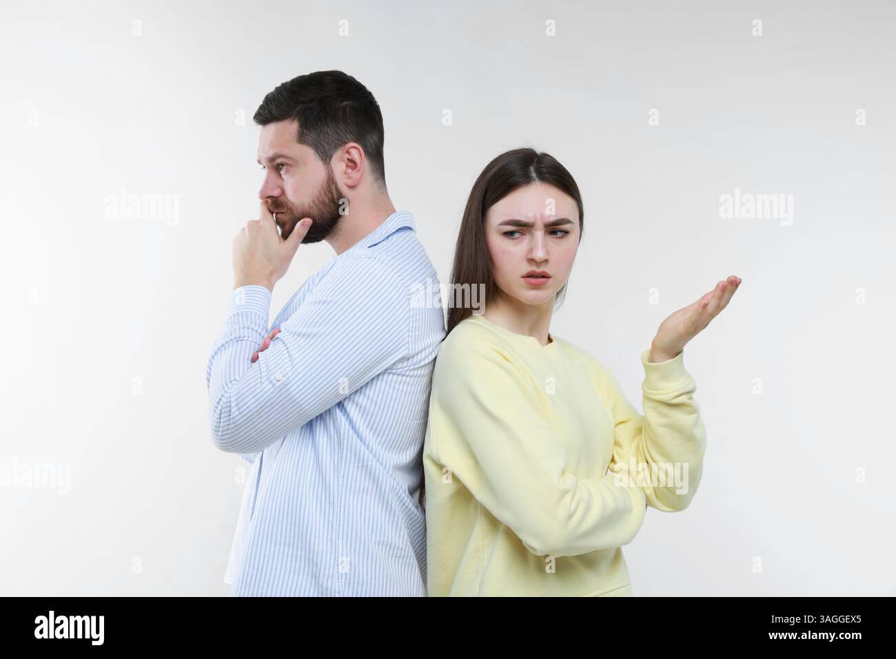 Resentful couple on light grey background. Relationship problem Stock ...