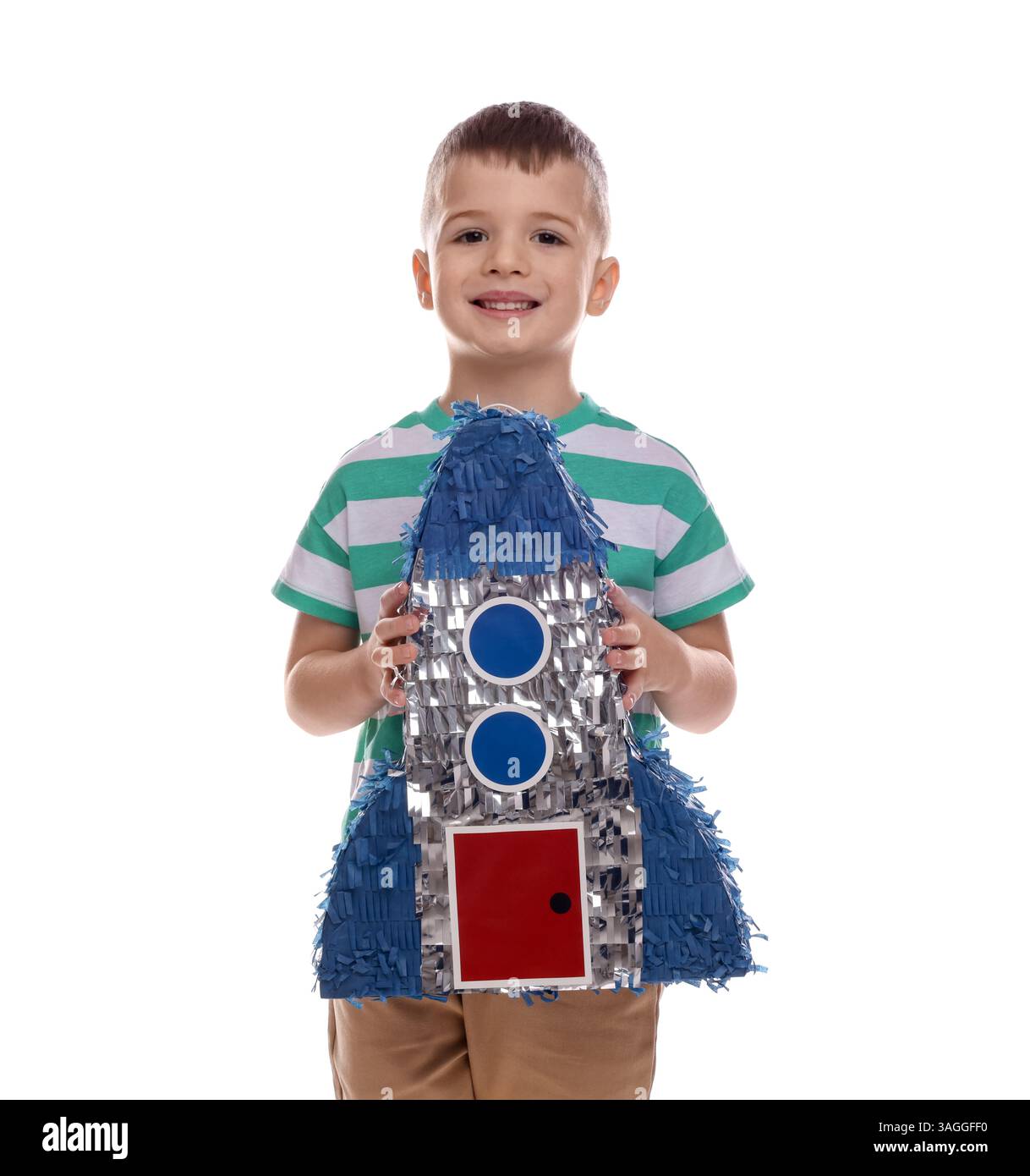Happy boy with rocket shaped pinata on white background Stock Photo - Alamy