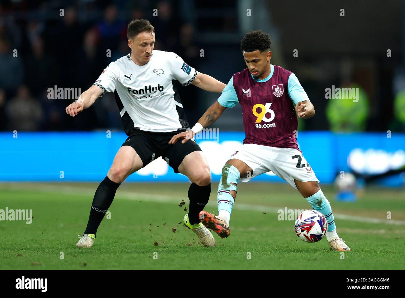 Derby County's Craig Forsyth (left) and Burnley's Marcus Edwards battle ...