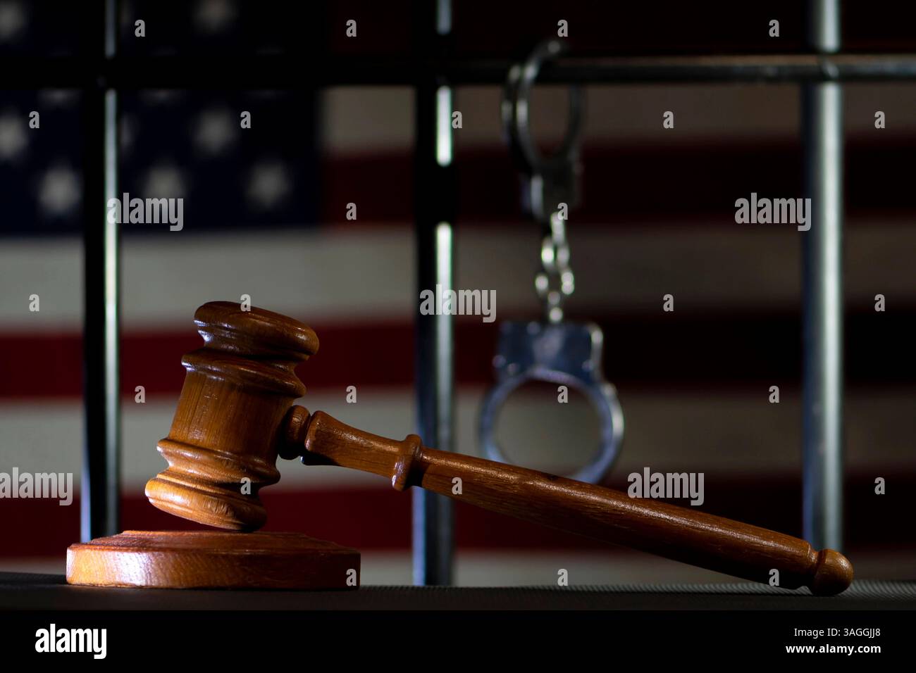 The judge's gavel against a background of the American flag, prison ...