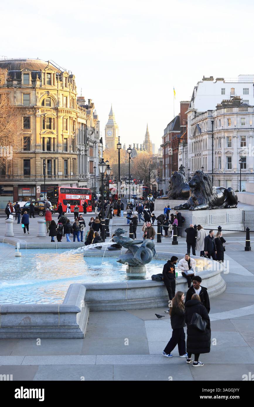 Trafalgar Square in winter sunshine with Big Ben on Whitehall beyond ...