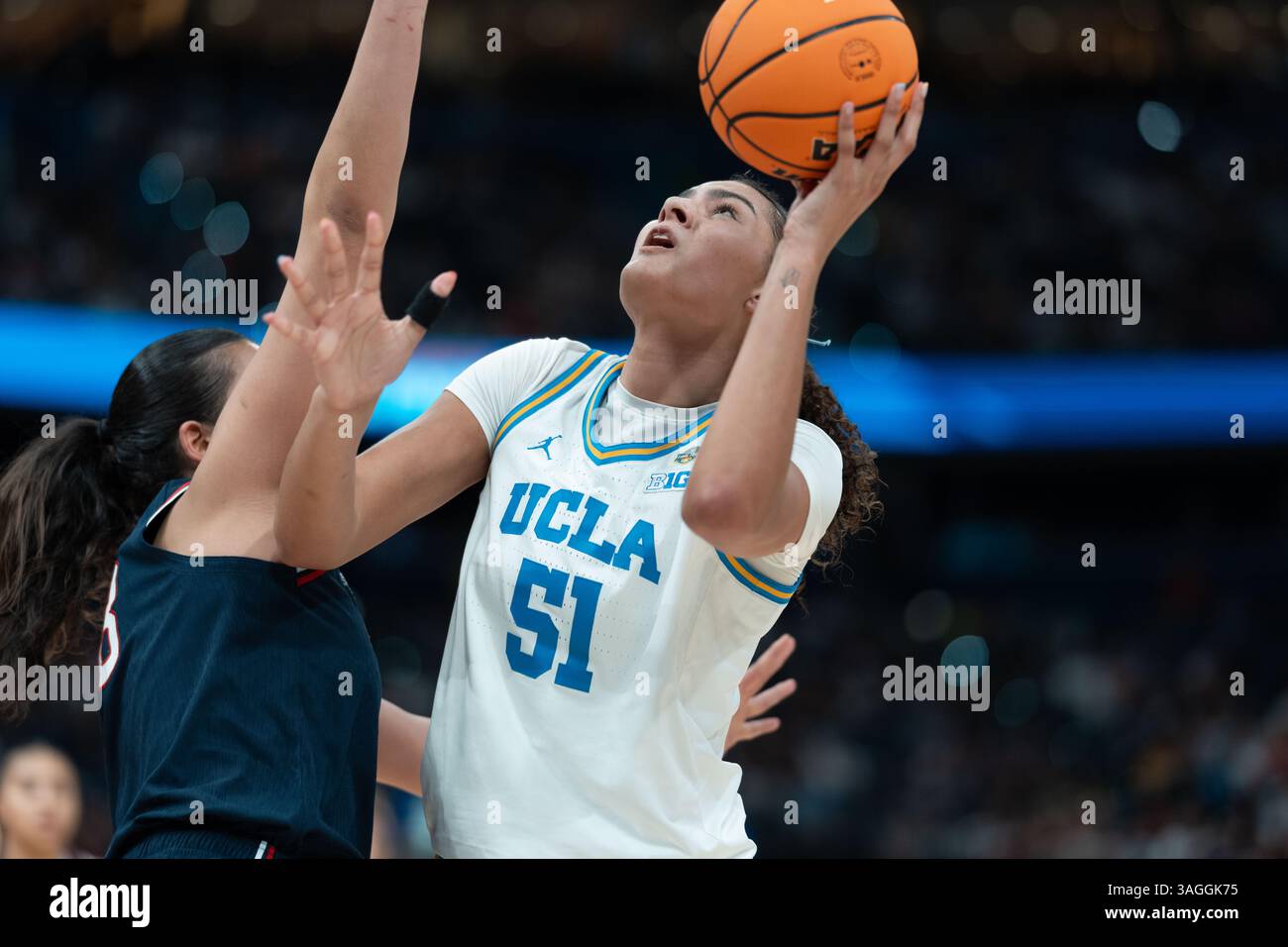 UCLA Bruins center Lauren Betts (51) shoots over UConn Huskies center Jana El Alfy (8) during ...