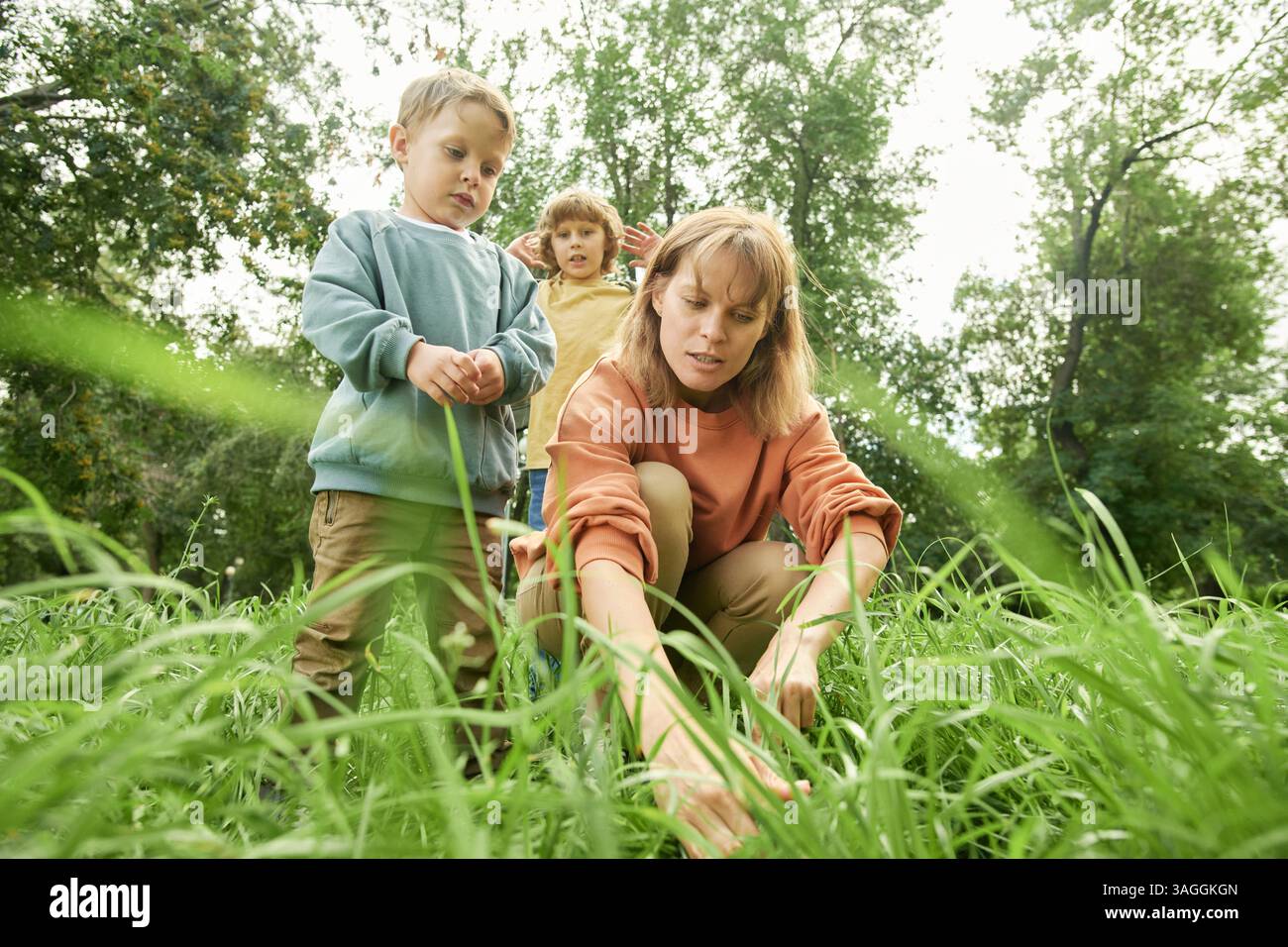 Kids with Mom Exploring Nature Stock Photo - Alamy