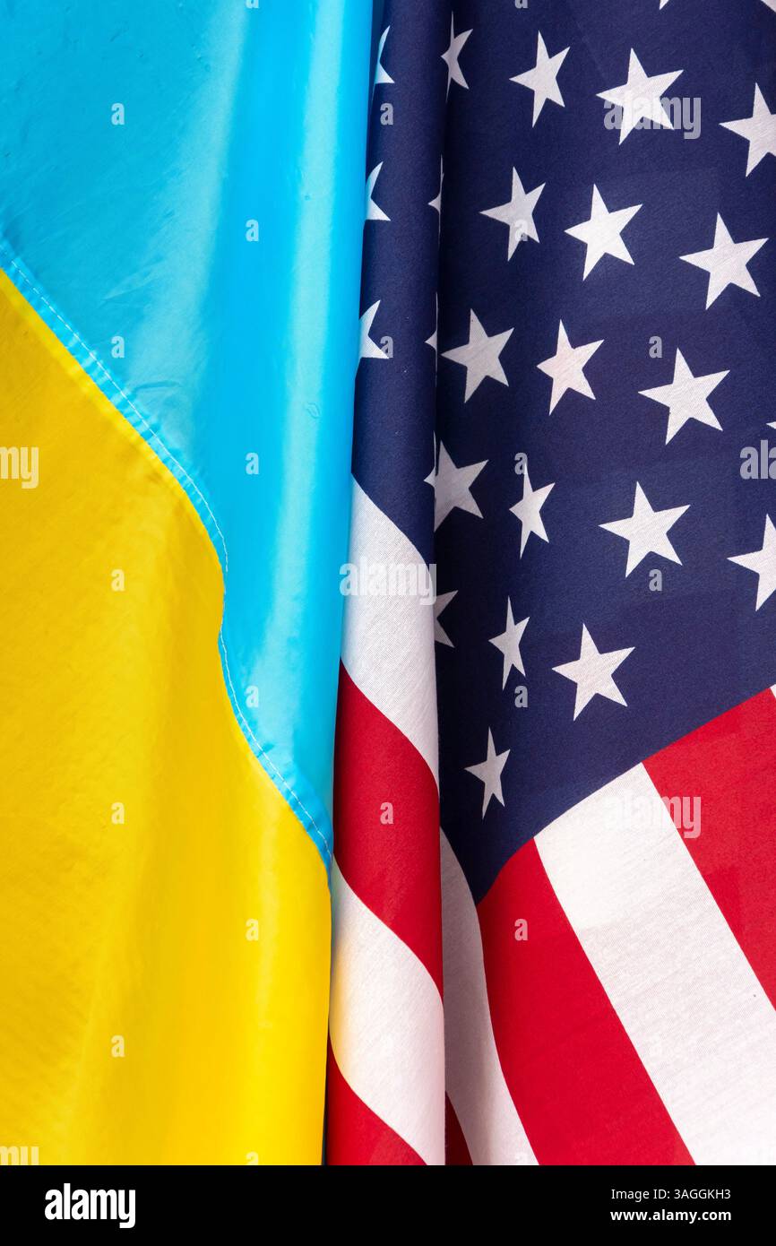 The flag of Ukraine and the flag of America are connected together ...