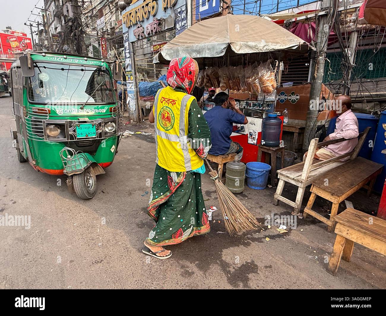 Woman sweeping the street, Chattogram , Bangladesh Stock Photo - Alamy