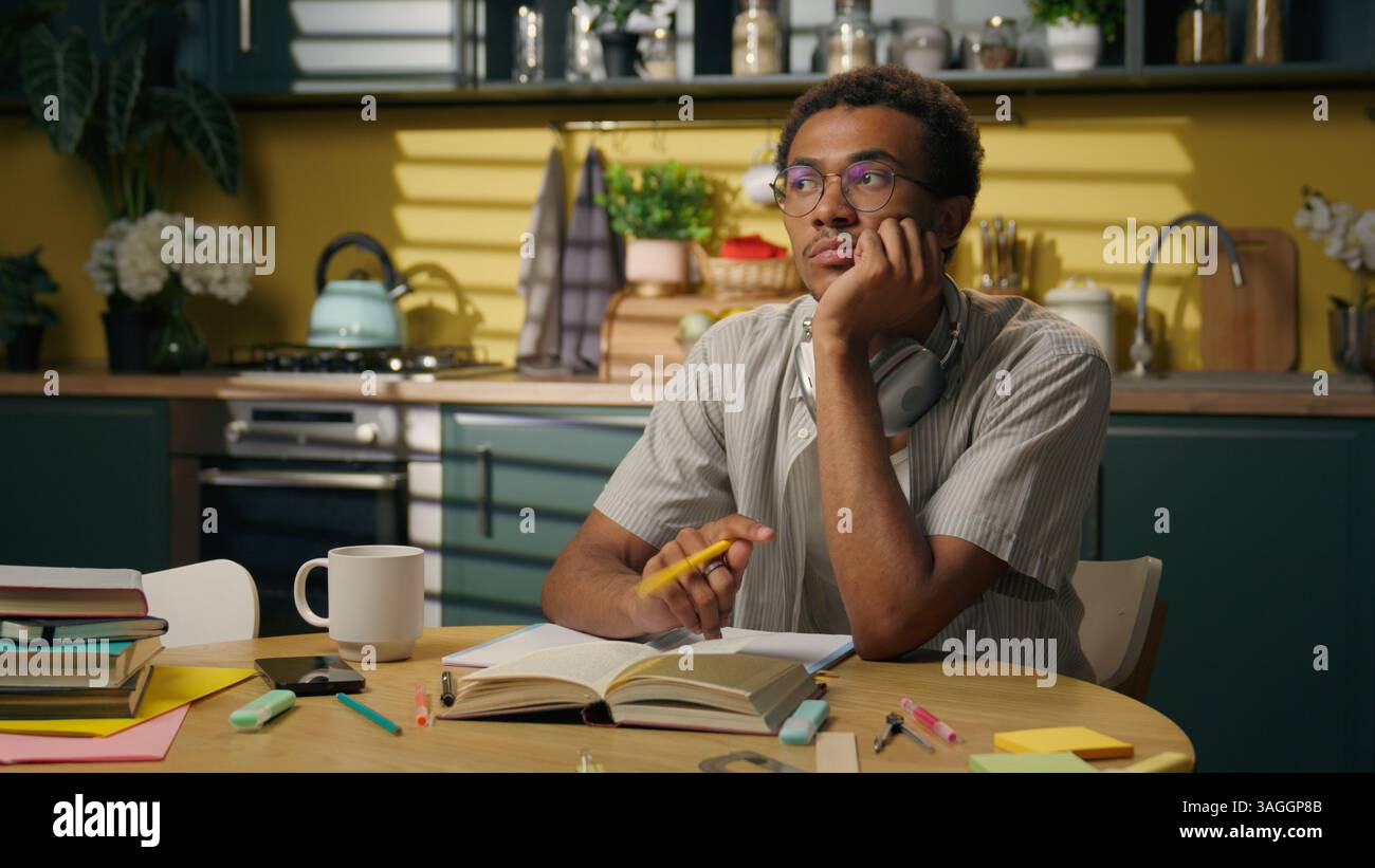 Thinking pensive deep thoughts African American guy sad thoughtful ...