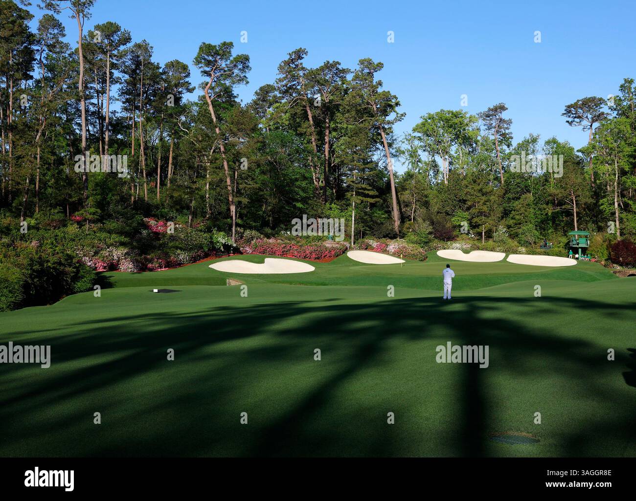 Augusta, United States. 08th Apr, 2025. A caddie walks on the 13th hole ...