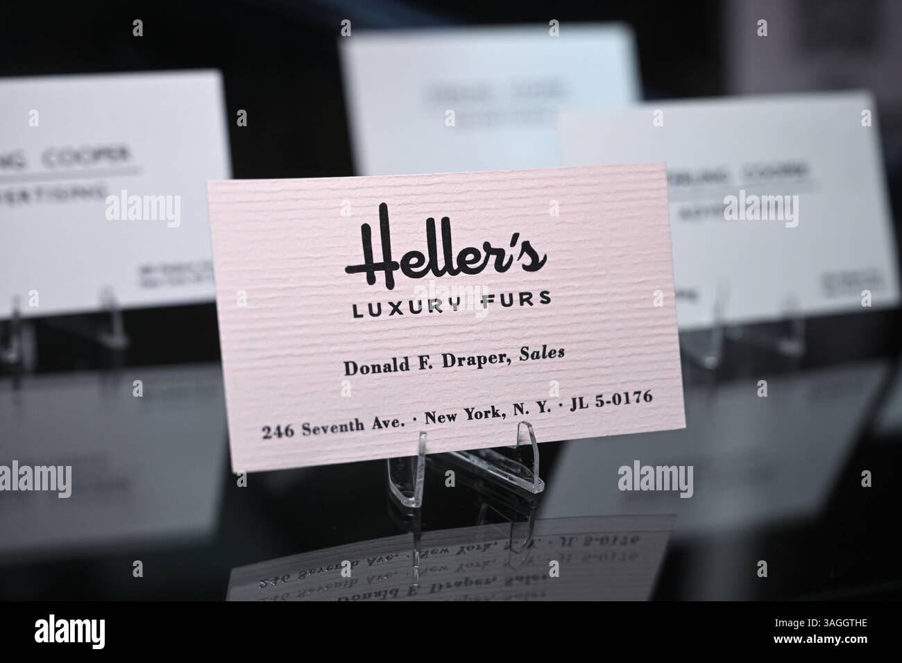 Mad Men Jon Hamm “Don Draper” business cards are displayed during an ...