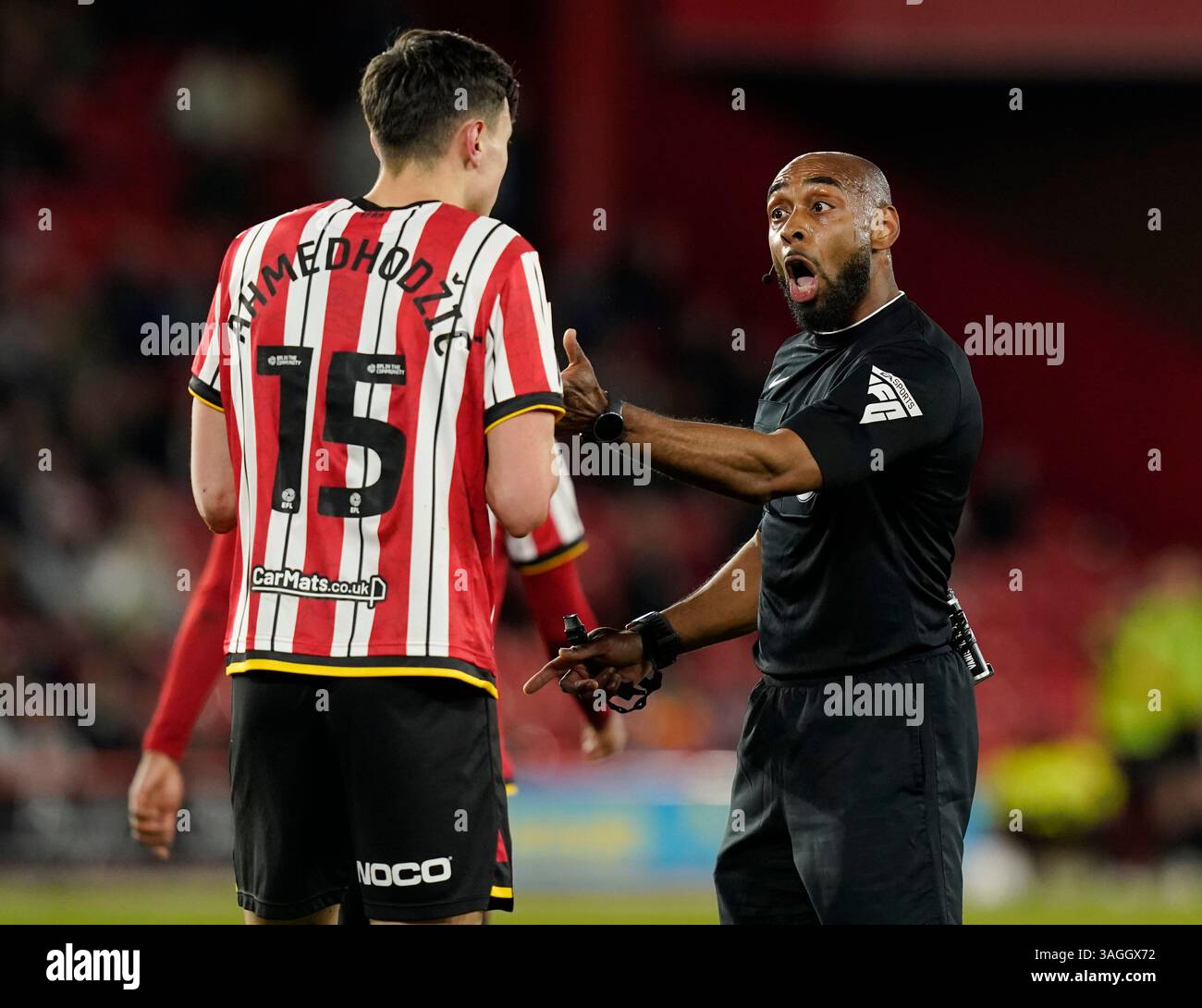 Sheffield, England, 8th April 2025. Referee Sam Allison speaks to Anel ...