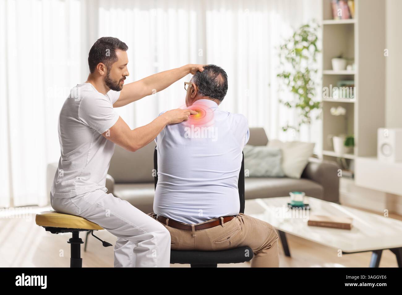 Chiropractor treating misalignments of joints on neck and spinal column ...