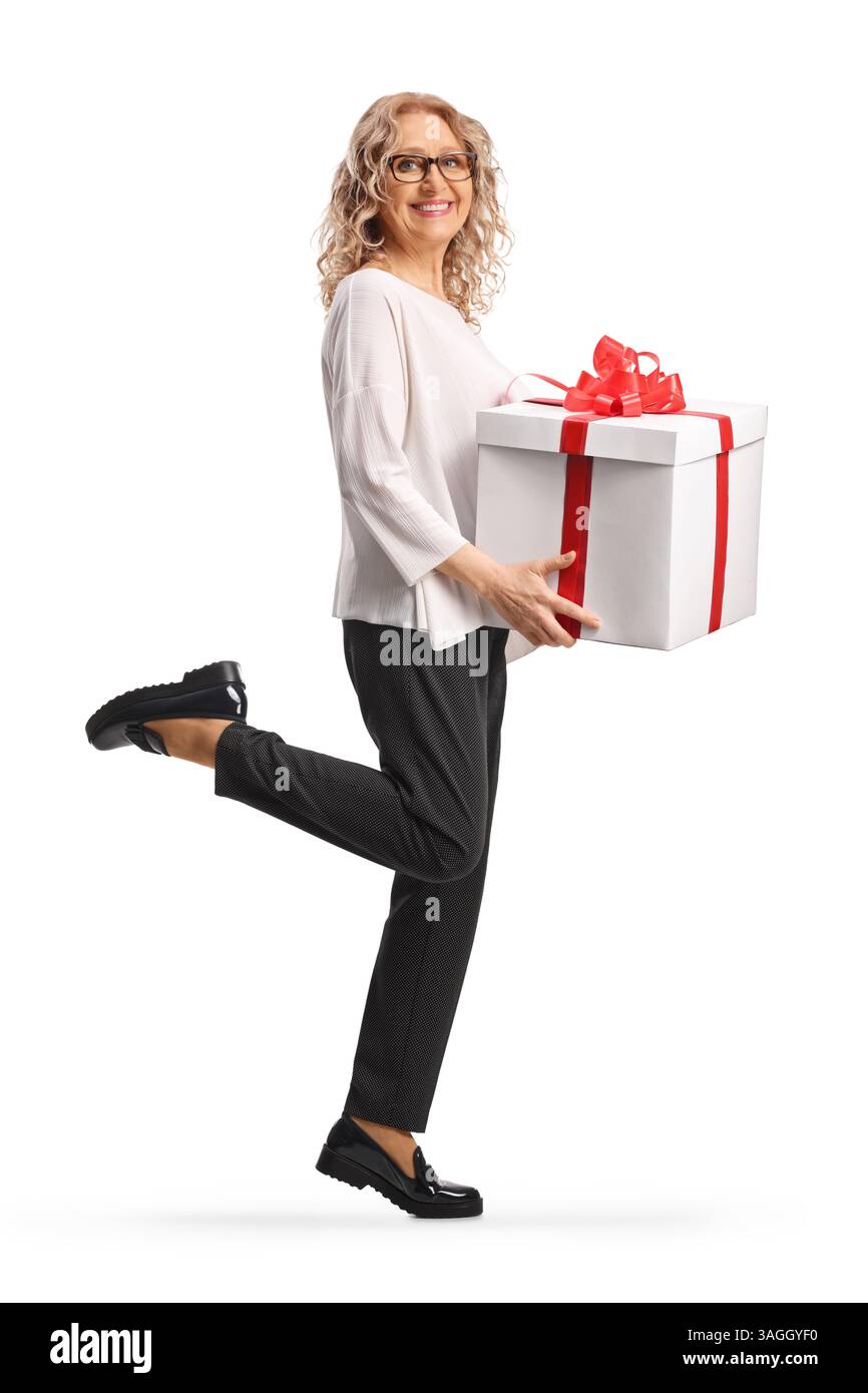 Excited woman jumping with a present isolated on white background Stock ...