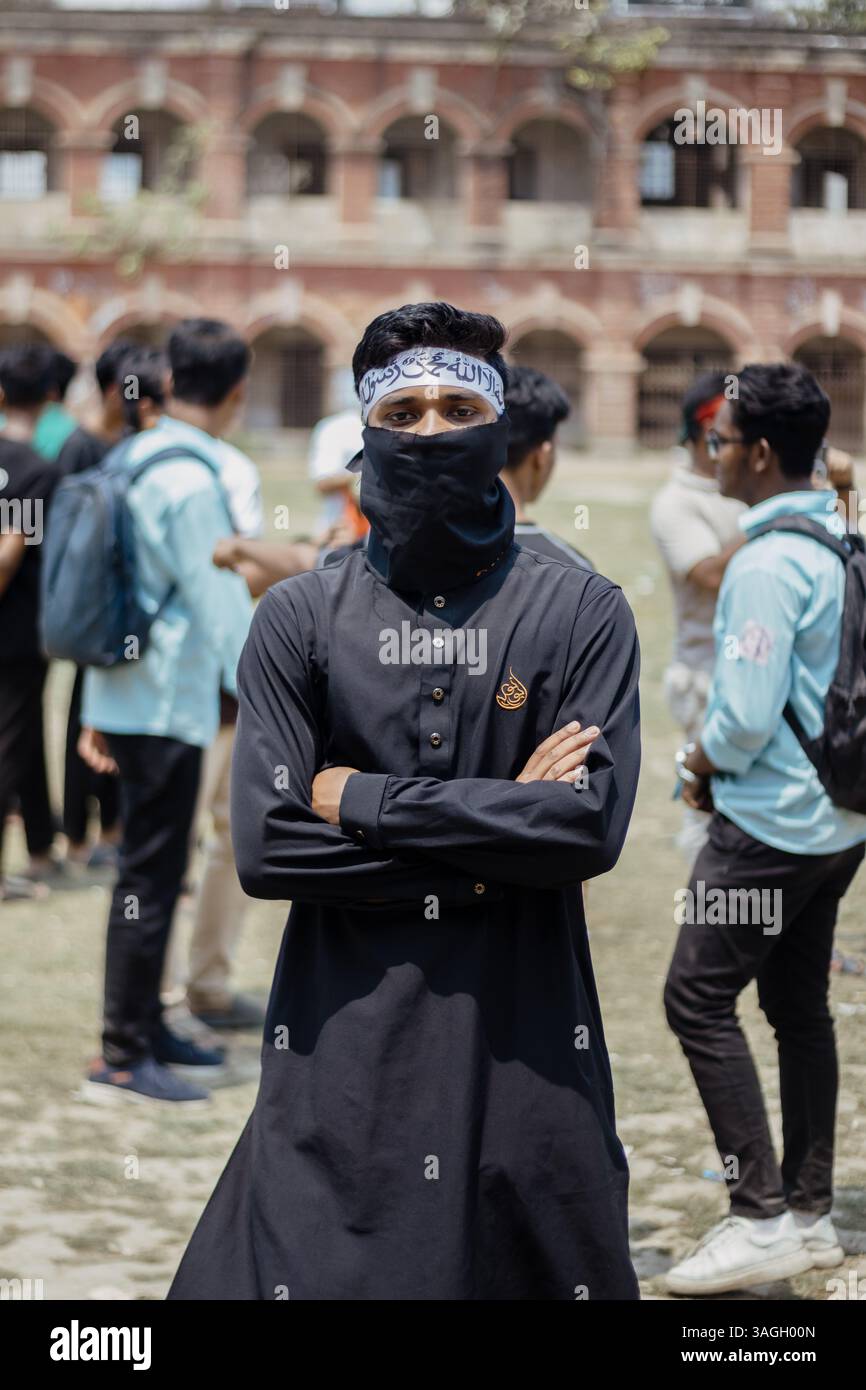 7 April 2025: Feni, Chittagong, Bangladesh: A boy wearing a black mask ...