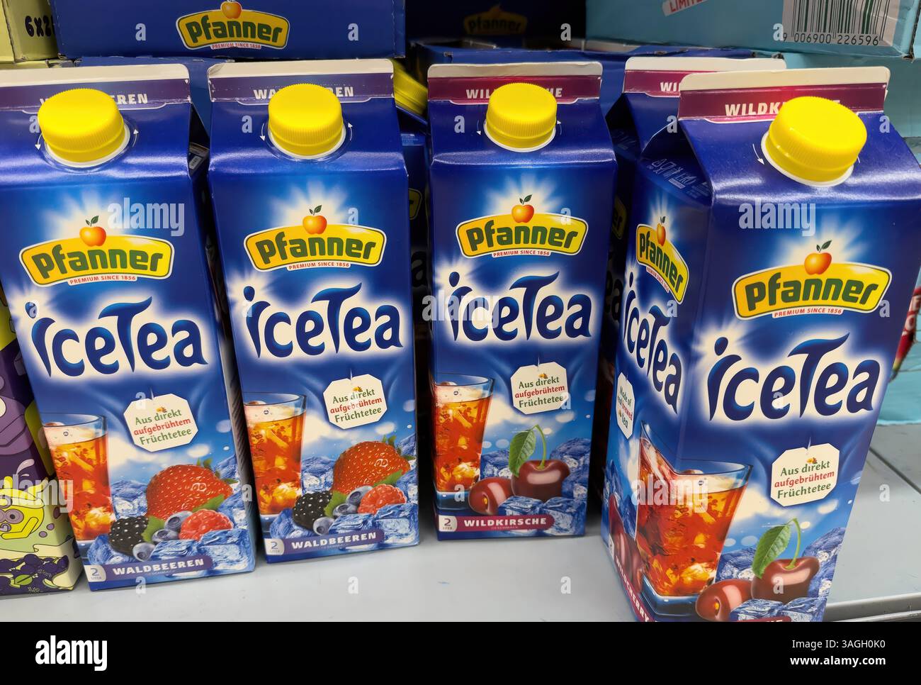 A vibrant collection of Pfanner ice tea cartons showcasing fruit ...