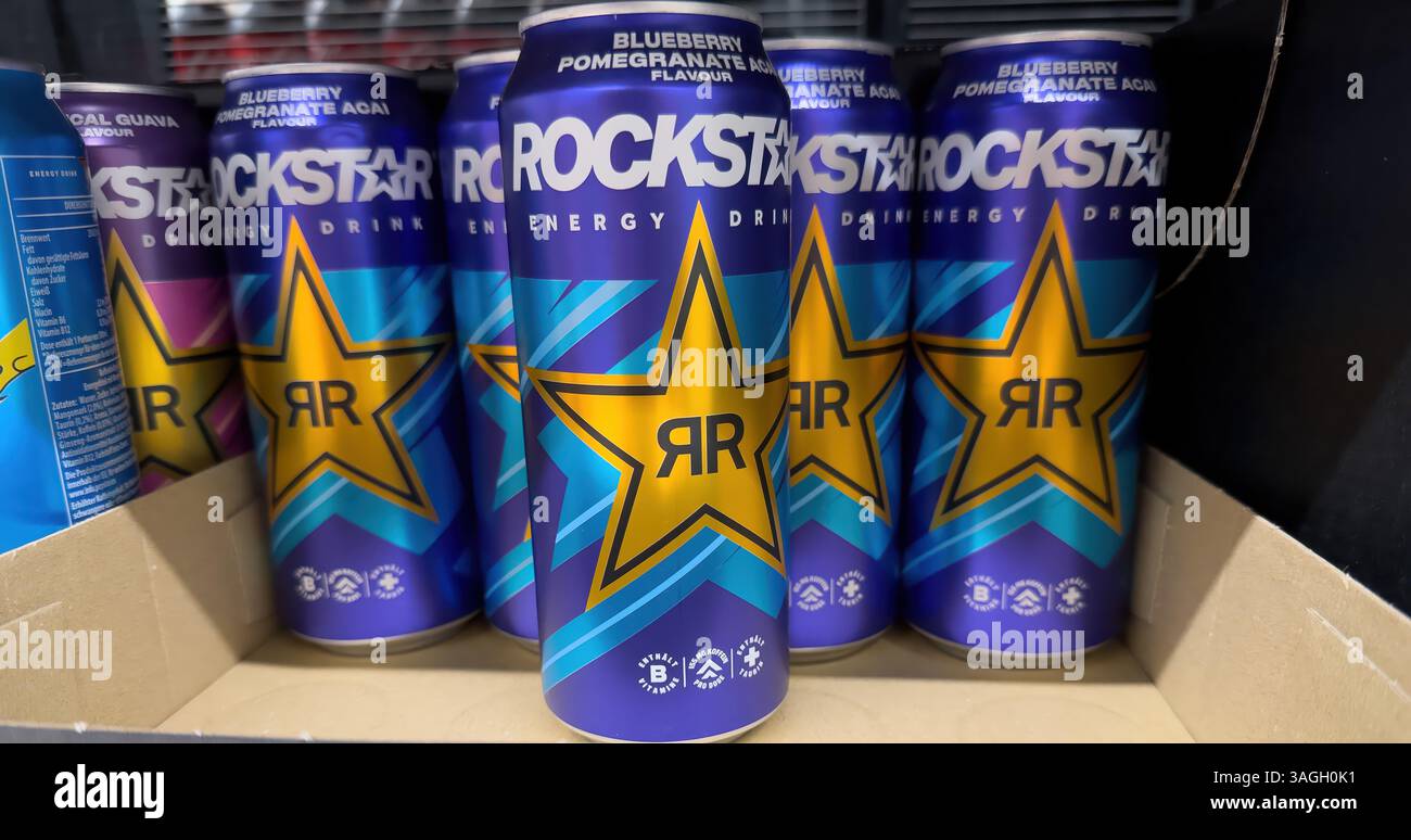 A striking display of Rockstar blueberry energy drink cans featuring a ...