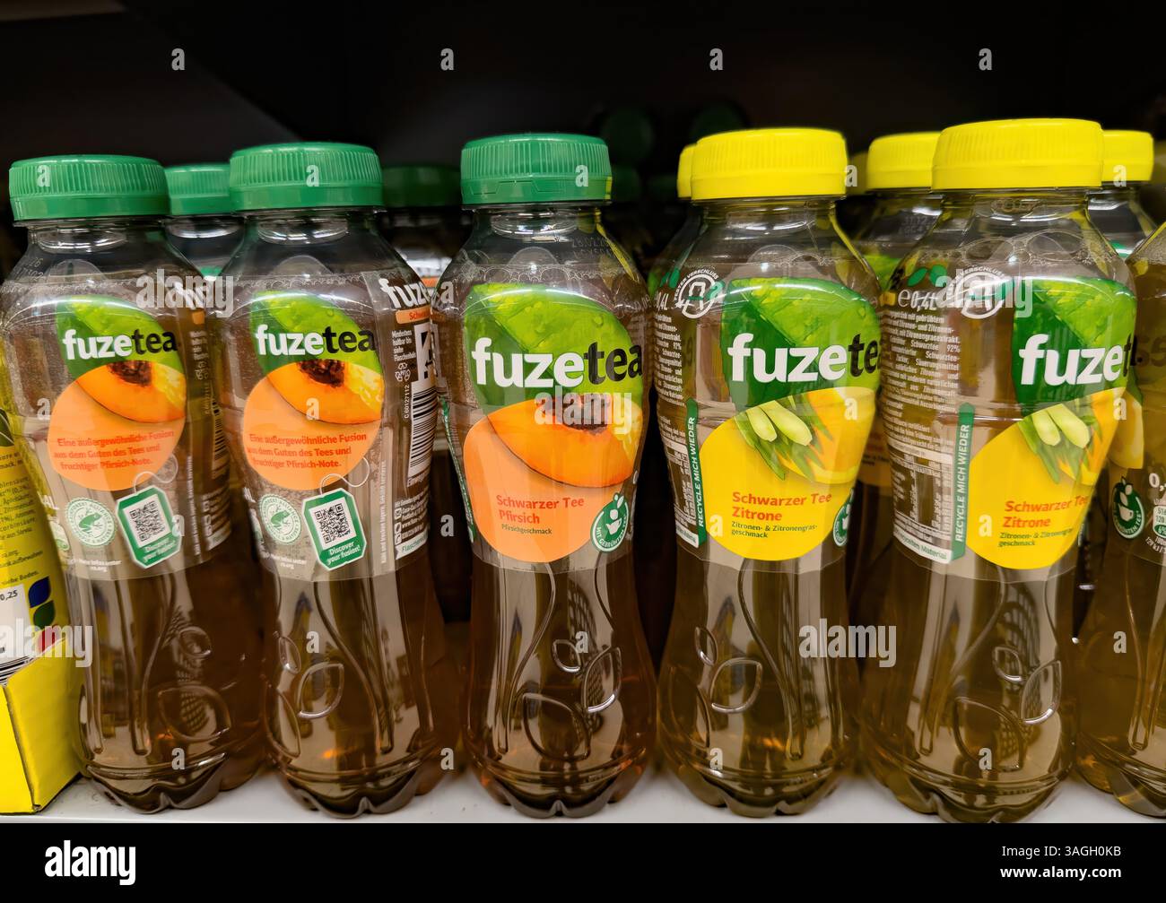 An organized display of Fuze Tea bottles featuring diverse flavors and ...