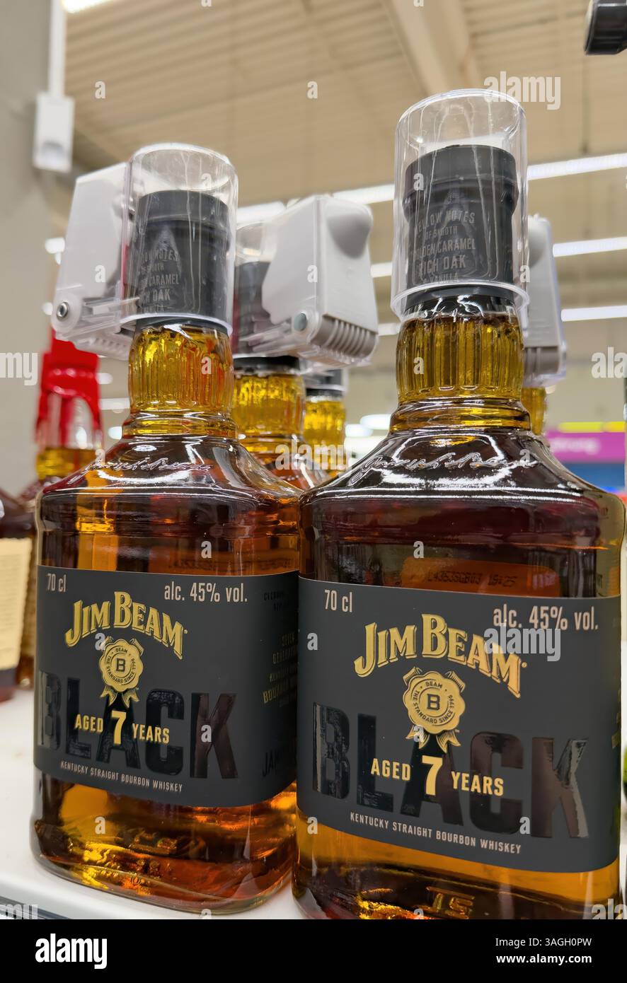 A clean display of Jim Beam bourbon bottles representing quality and ...