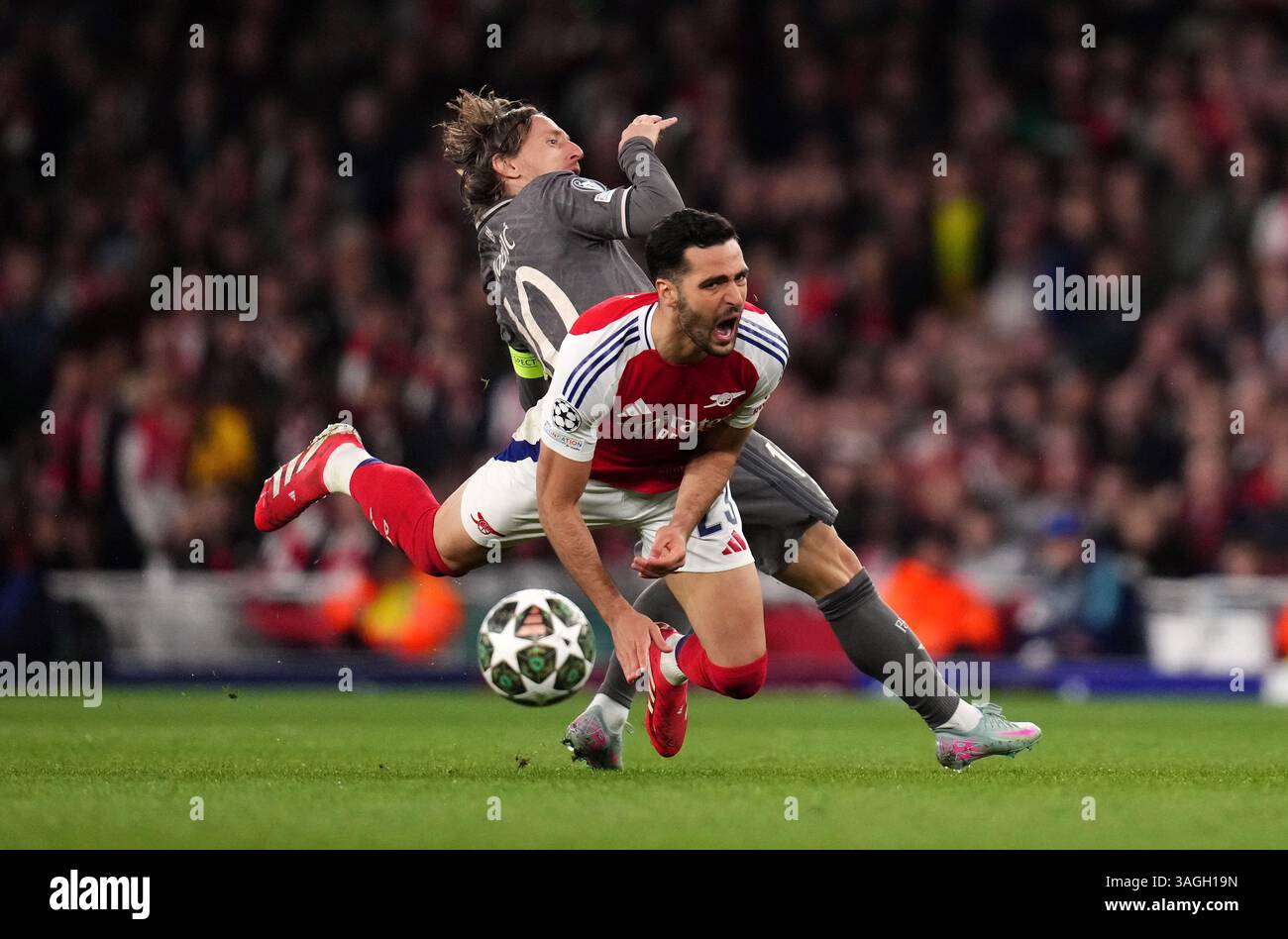 Arsenal's Mikel Merino and Real Madrid's Luka Modric battle for the ...