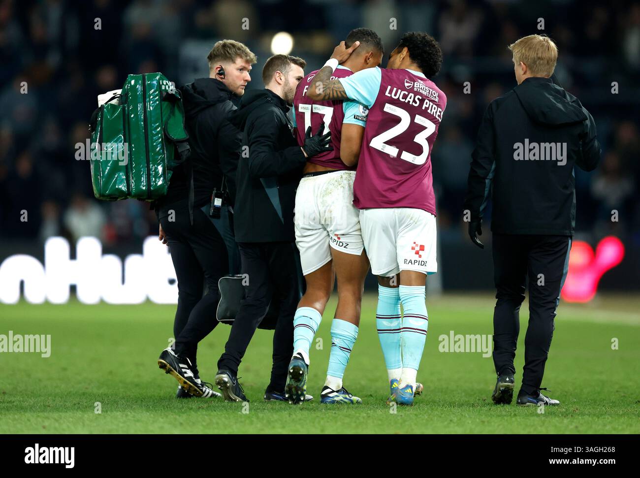 Burnley's Lyle Foster (centre) is consoled by team-mate Lucas Pires ...
