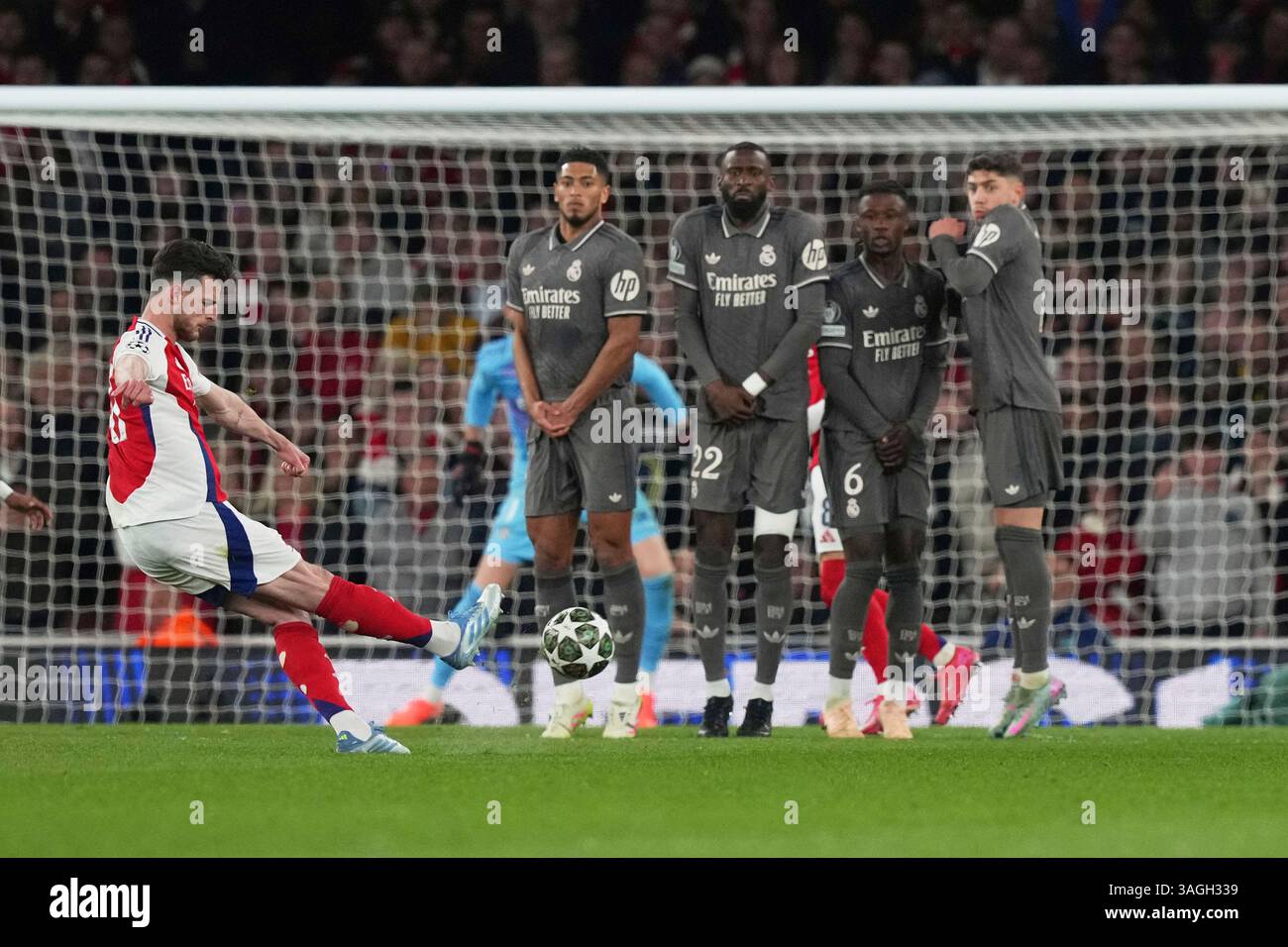 Arsenal's Declan Rice, left, scores his side's opening goal during the ...