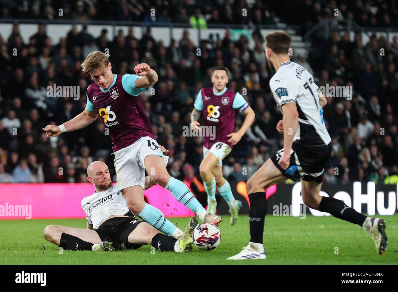 Derby, UK. 08th Apr, 2025. Matthew Clarke of Derby County tackles Zian ...