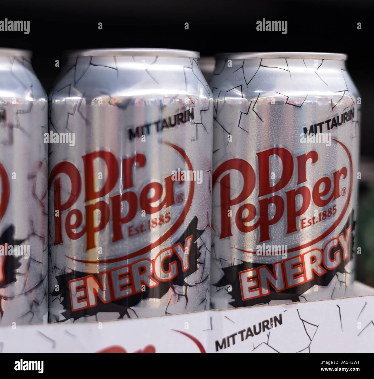 A vibrant display of Dr. Pepper energy drink cans with a striking ...