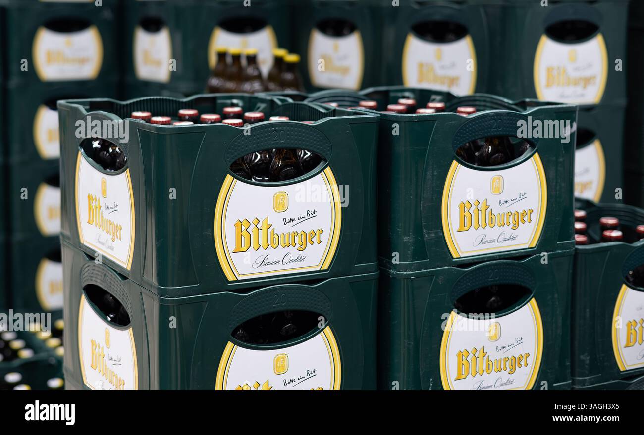 A neatly organized stack of Bitburger beer bottles, showcasing the ...