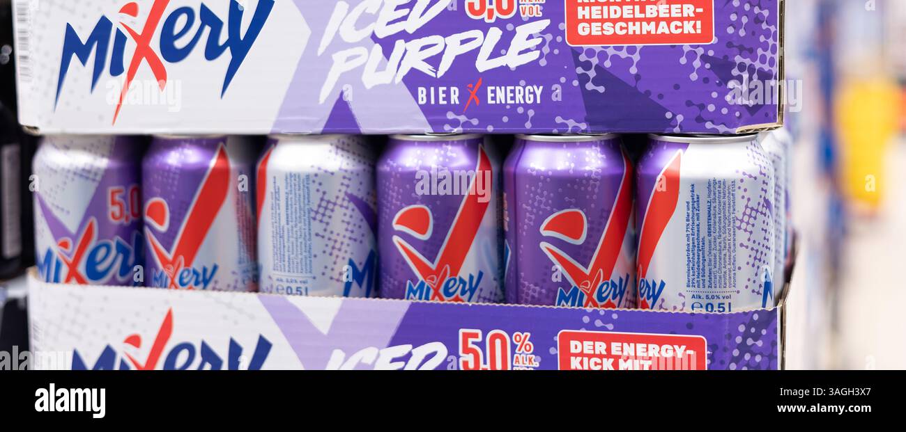 A vibrant display of Mixery iced purple cans, showcasing a unique blend ...