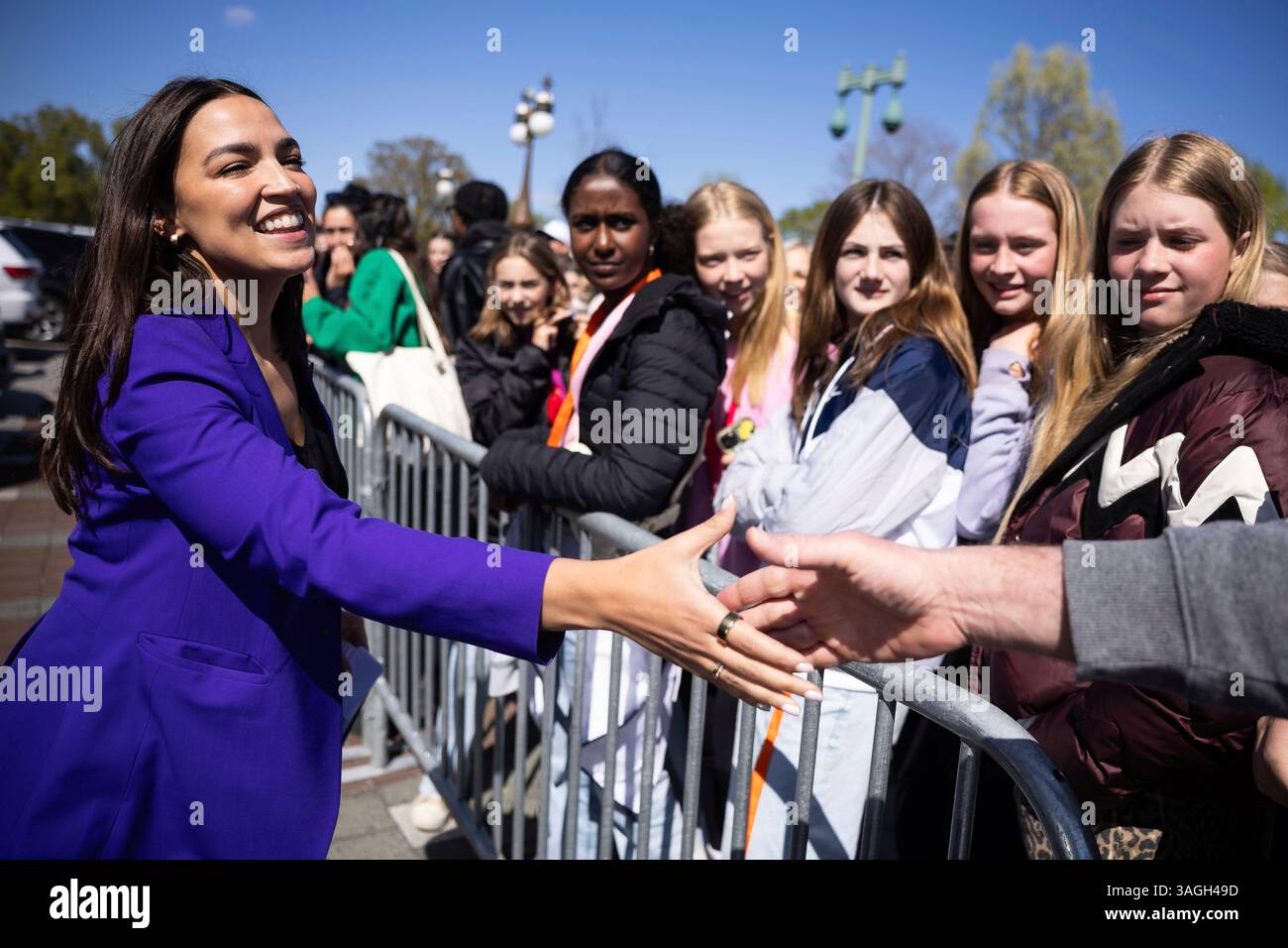 Rep. Alexandria Ocasio-Cortez (D-N.Y.) greets supporters as she departs ...