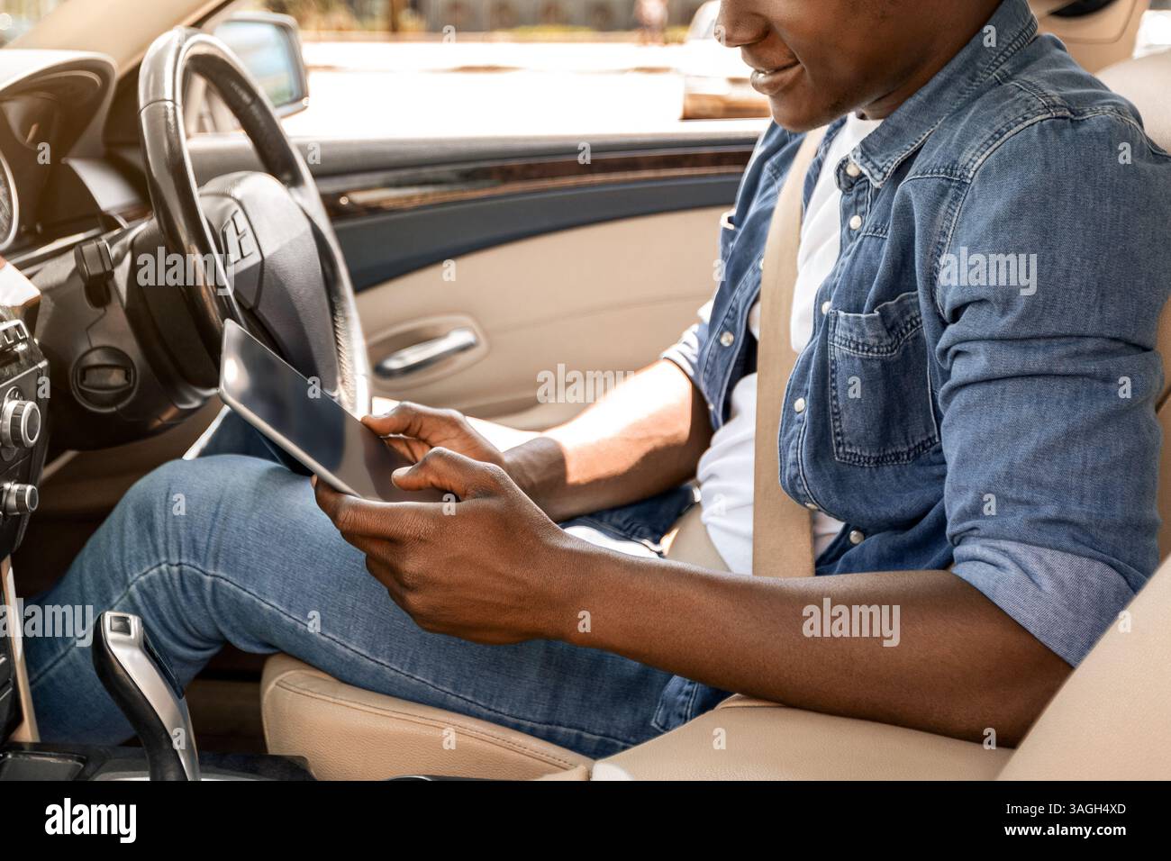 Positive male driver using trip hi-res stock photography and images - Alamy