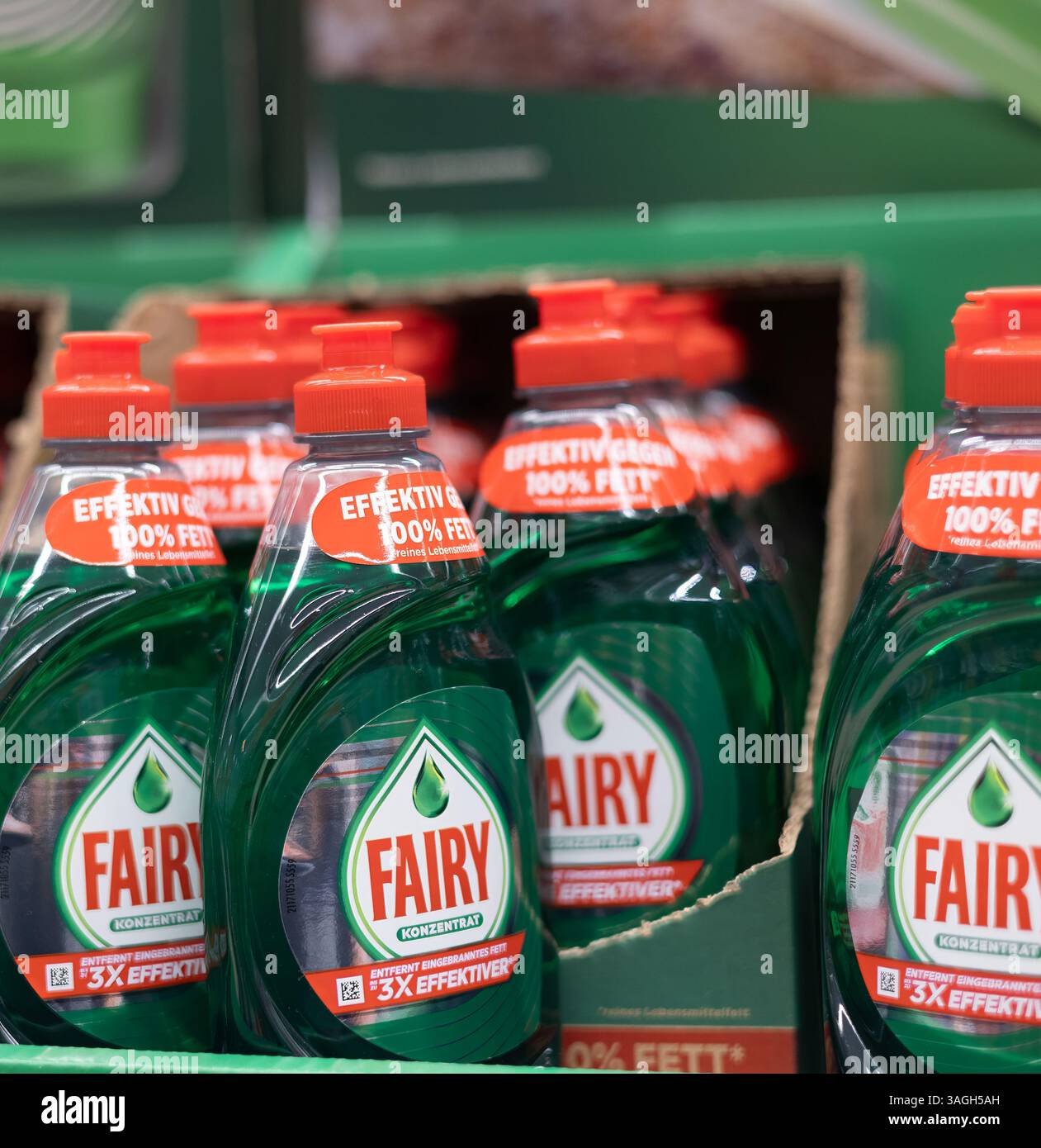 A collection of Fairy dishwashing liquid bottles arranged in a neat ...