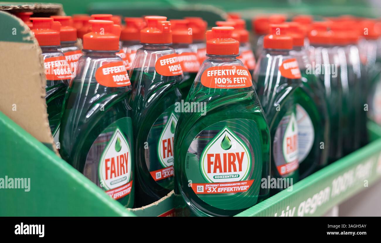 A collection of Fairy dishwashing liquid bottles arranged in a neat ...