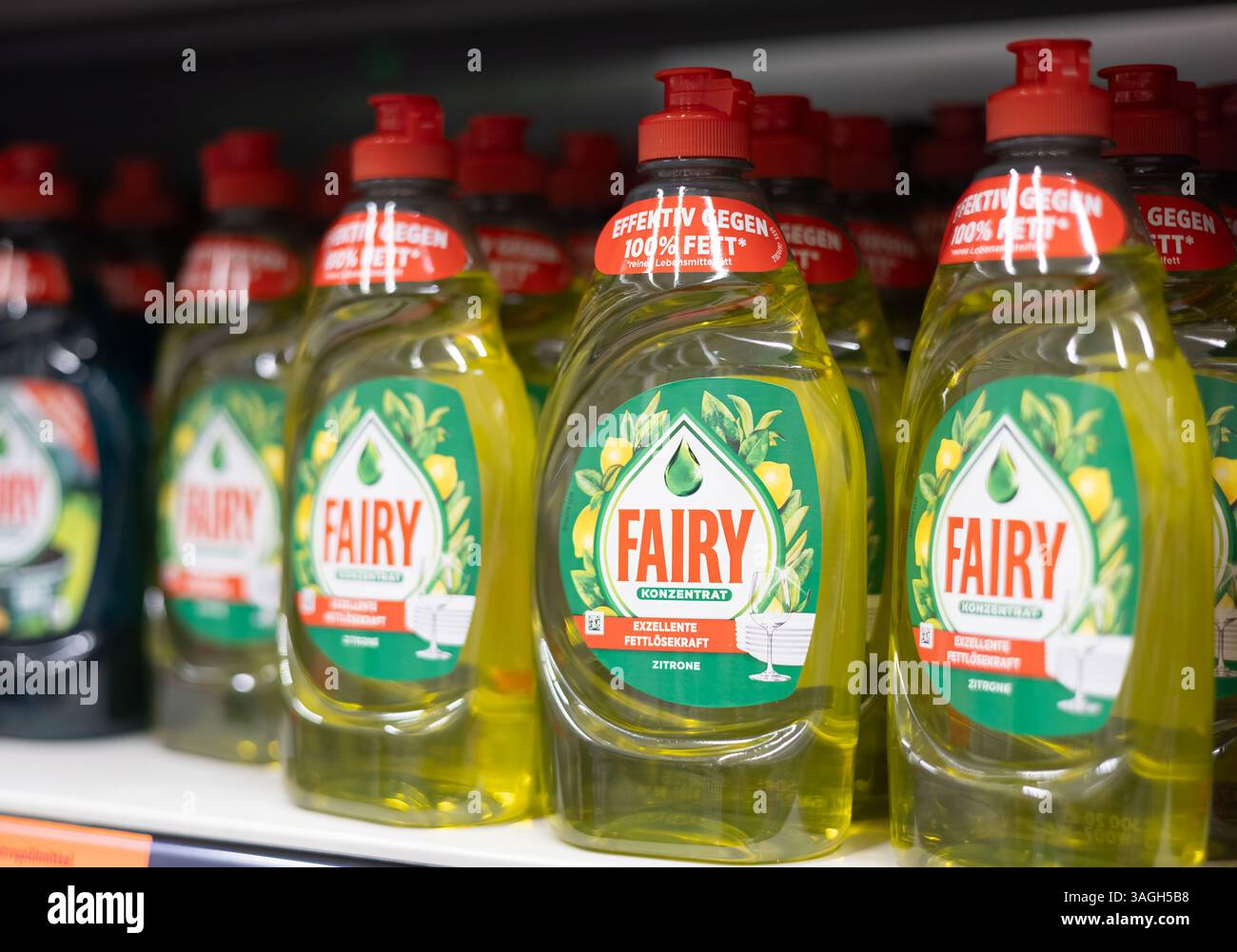 A collection of Fairy dishwashing liquid bottles arranged in a neat ...