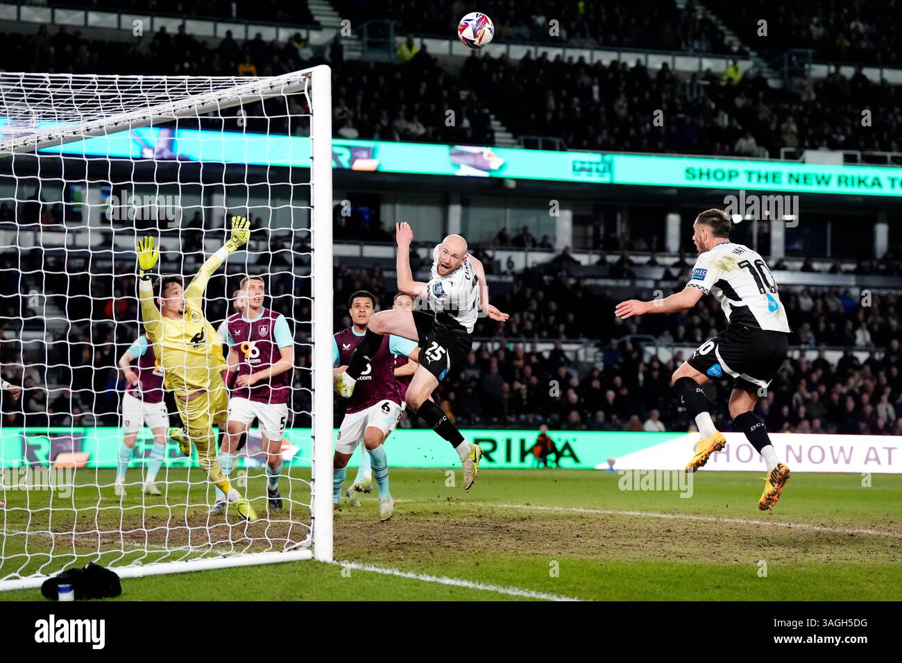 Derby County's Matt Clarke (centre) misses an opportunity on goal ...