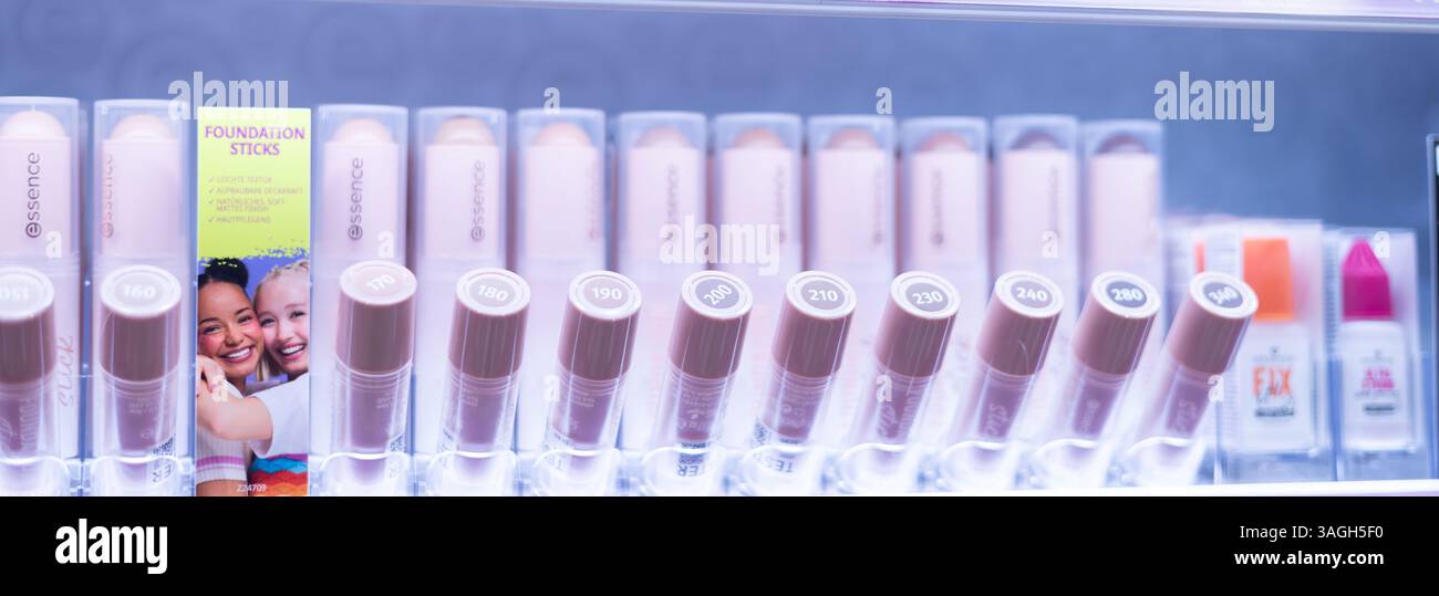 Essence foundation sticks organized neatly, representing a range of ...