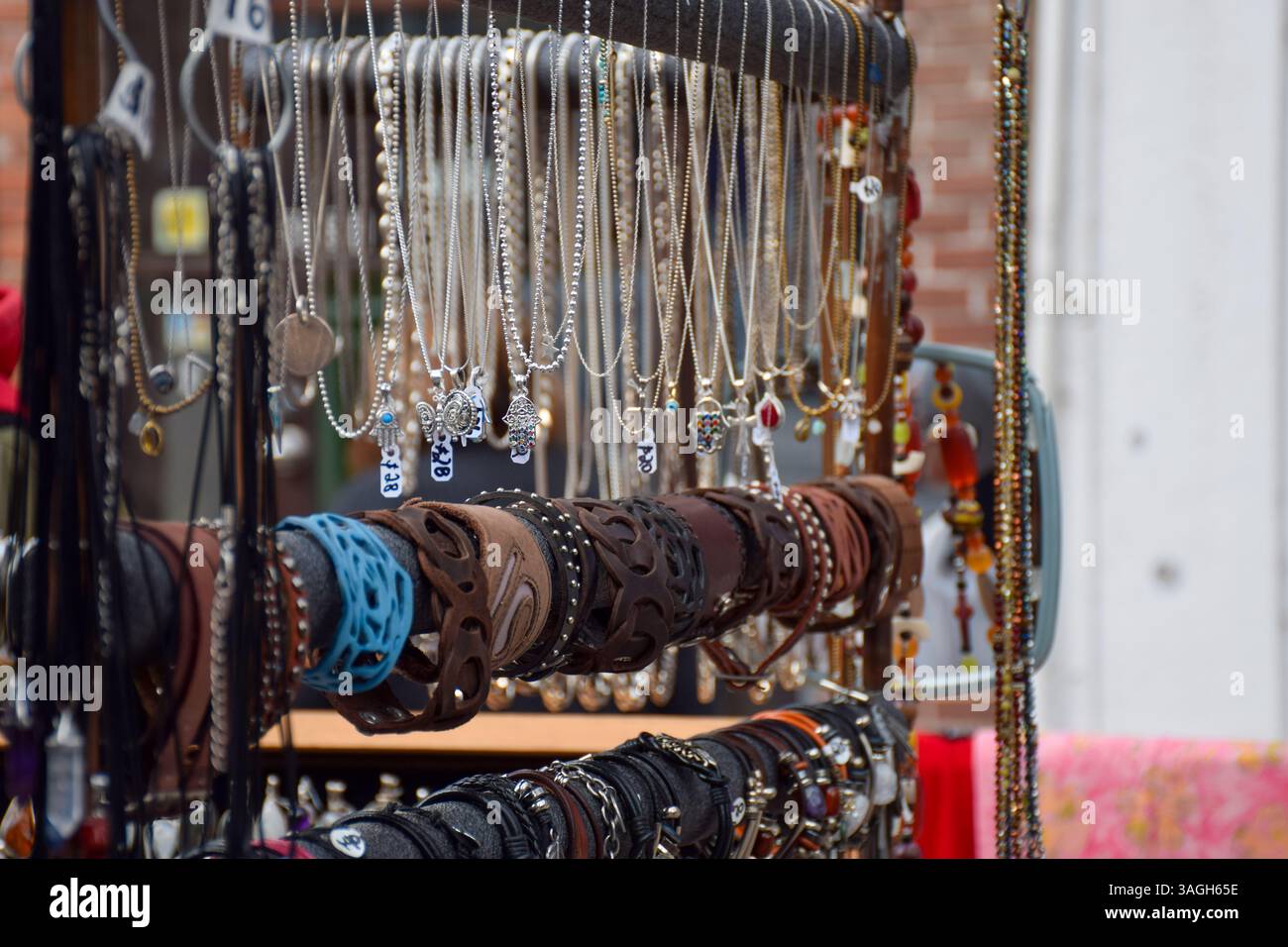 Handmade artisanal jewelry and accessories on display at a street ...