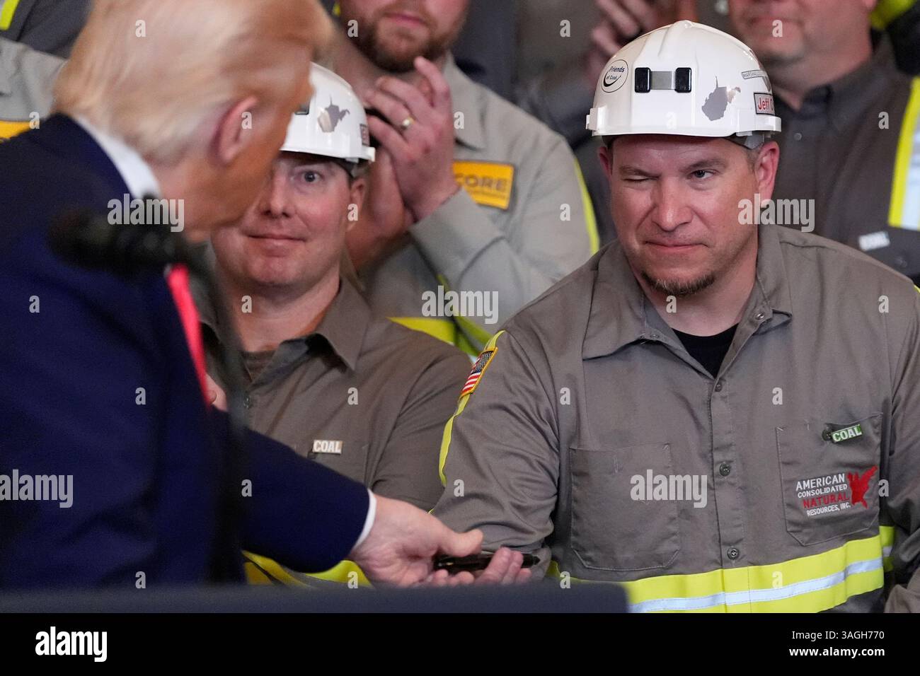 Coal miner Jeff Crowe winks at President Donald Trump after he signed ...