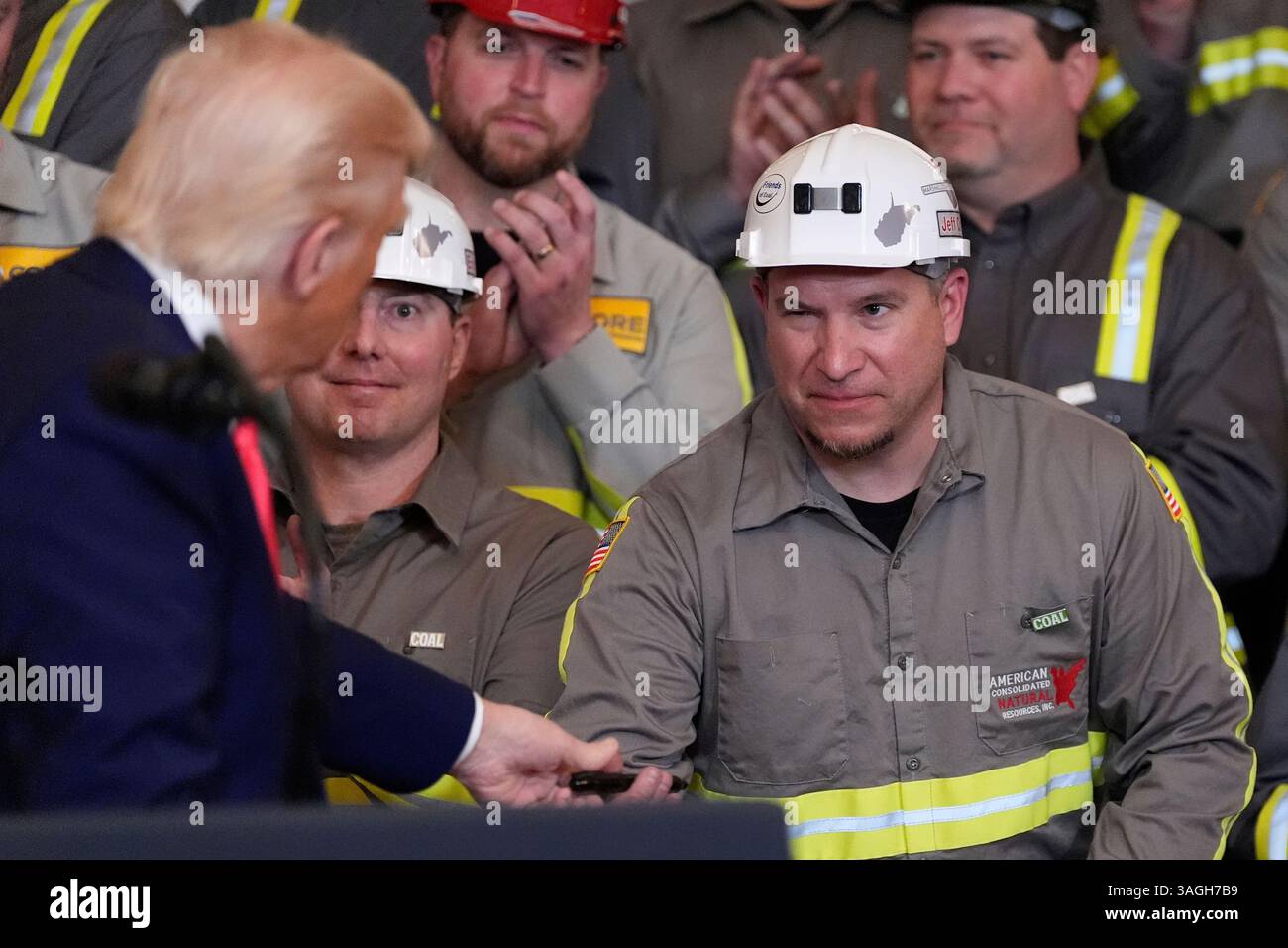 Coal miner Jeff Crowe winks at President Donald Trump after he signed ...