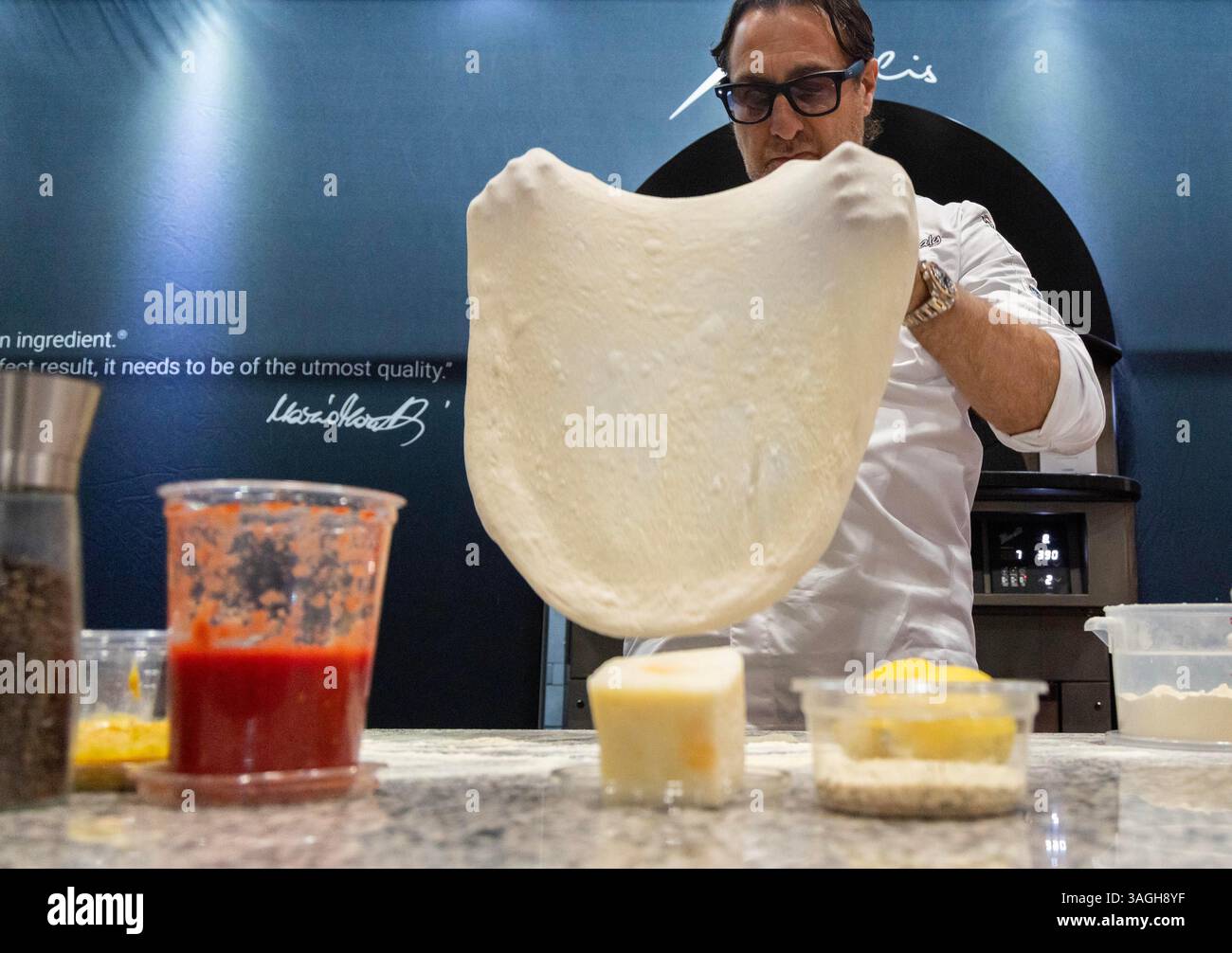 Toronto, Canada. 8th Apr, 2025. A contestant competes during a pizza ...