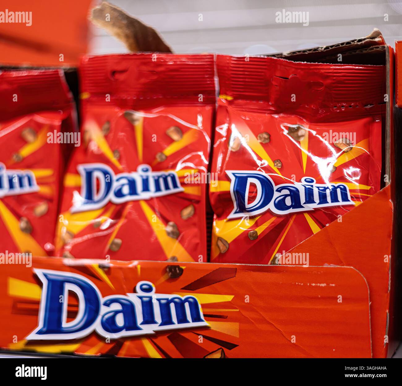 A close-up view showcasing vibrant packaging of Daim chocolate bars ...