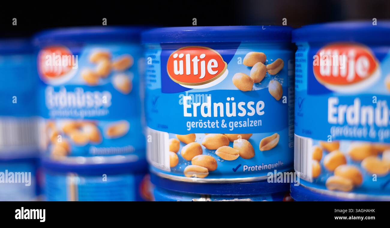 A visually appealing arrangement of roasted salted peanuts in blue ...