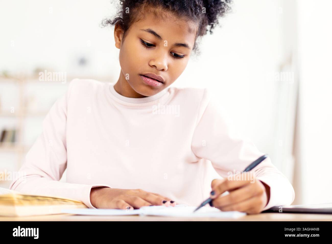 Black Teen Girl Writing Doing Homework Learning Sitting At Home Stock ...