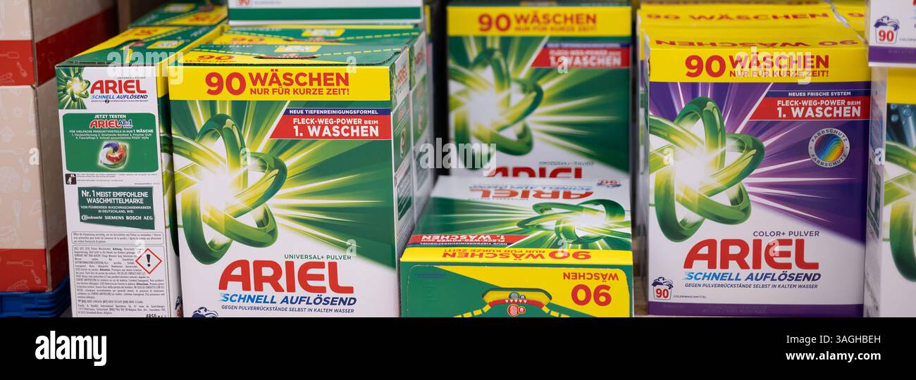 This image features a box of Ariel laundry powder prominently displayed ...