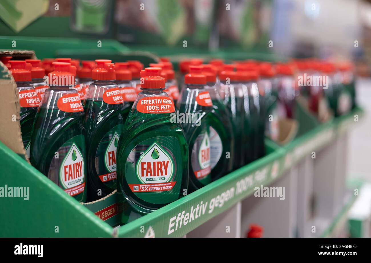 A collection of Fairy dishwashing liquid bottles arranged in a neat ...