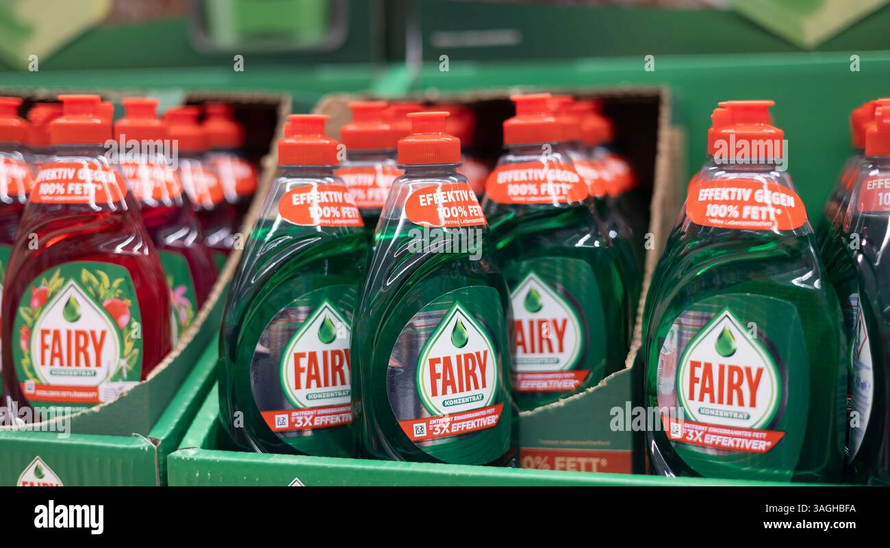 A collection of Fairy dishwashing liquid bottles arranged in a neat ...