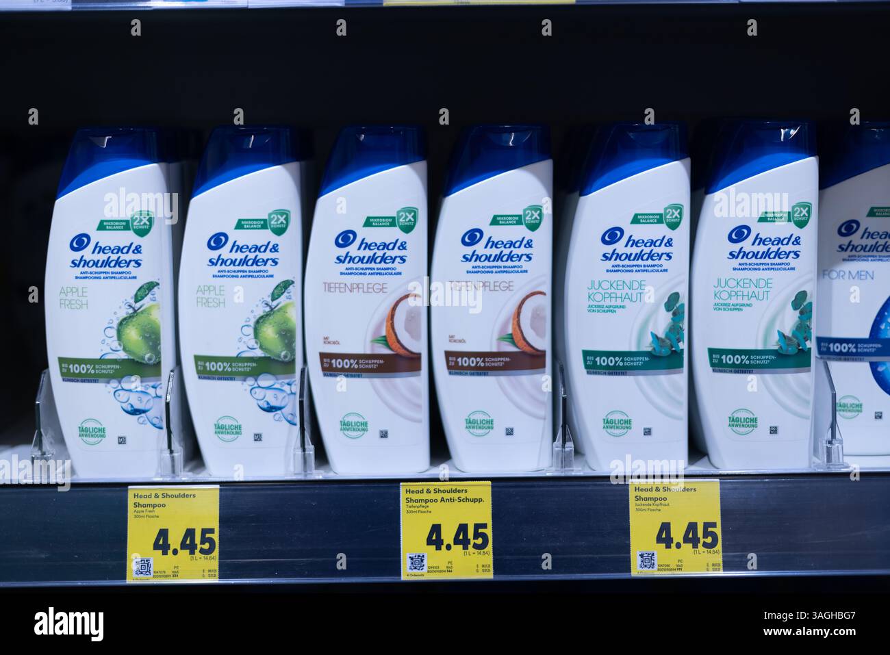 A neat lineup of Head and Shoulders shampoo bottles, emphasizing their ...