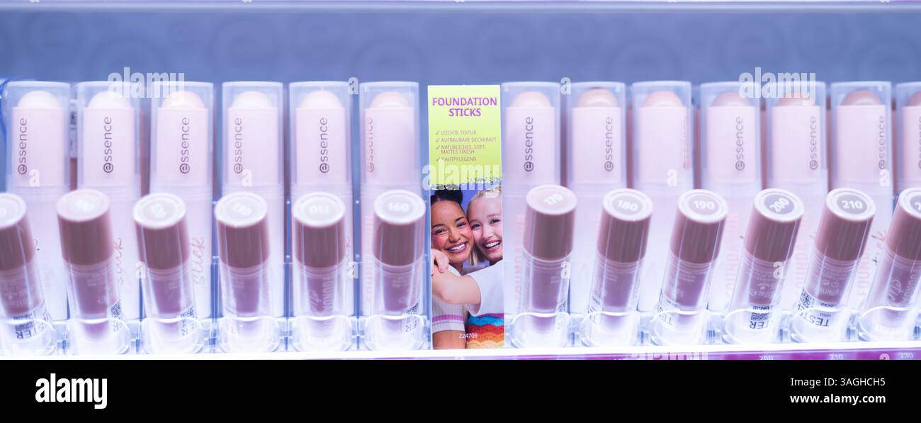 Essence foundation sticks organized neatly, representing a range of ...