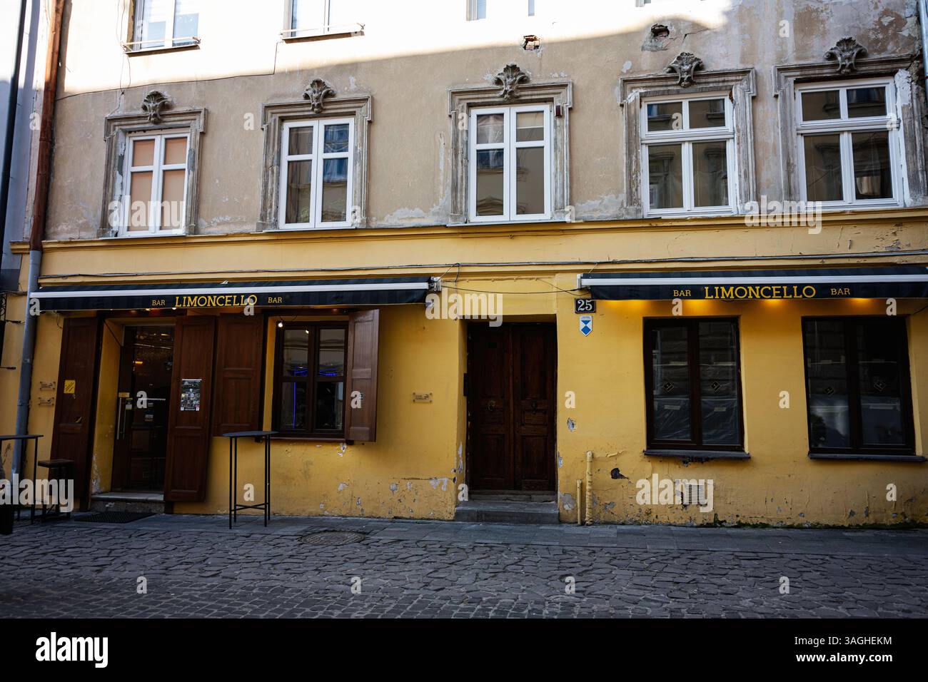 Lviv, Ukraine - April 07, 2025: Yellow building facade featuring ...