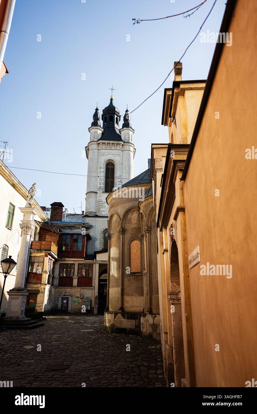 Lviv, Ukraine - April 07, 2025: Stone buildings with beautiful details and quiet street in ...